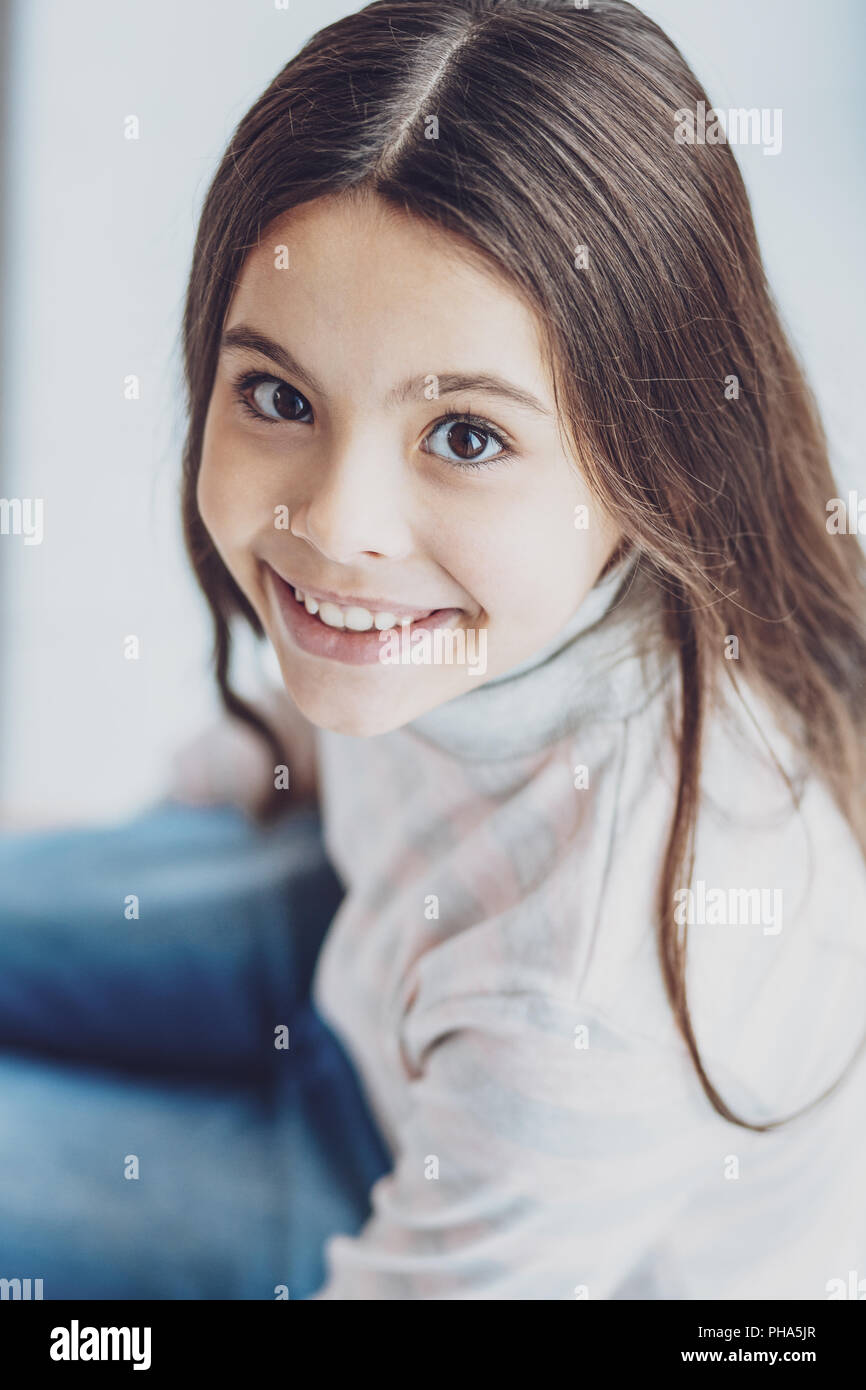 Adorable little girl looking at you with sparkling eyes Stock Photo - Alamy