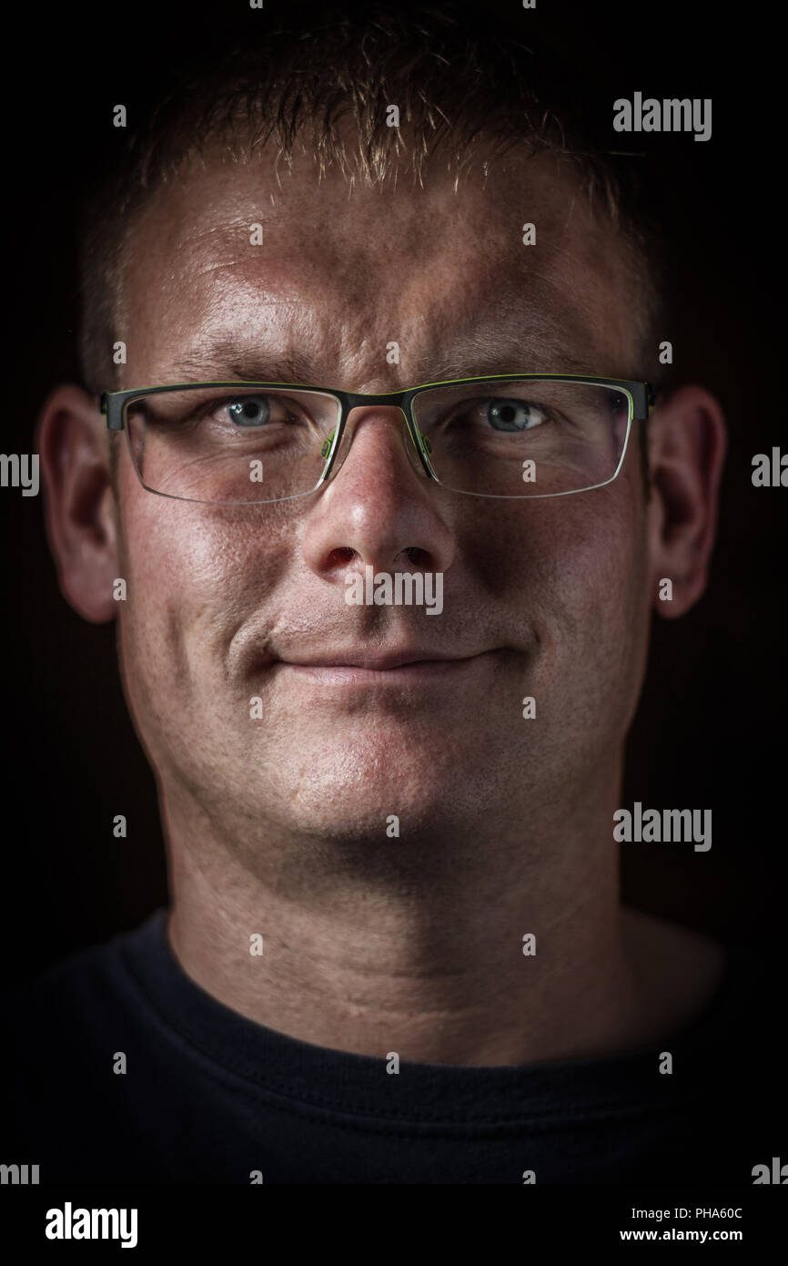 Man against black background Stock Photo - Alamy