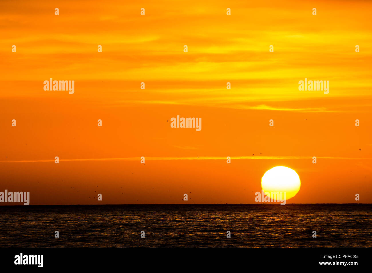 Reflection setting sun in hi-res stock photography and images - Alamy