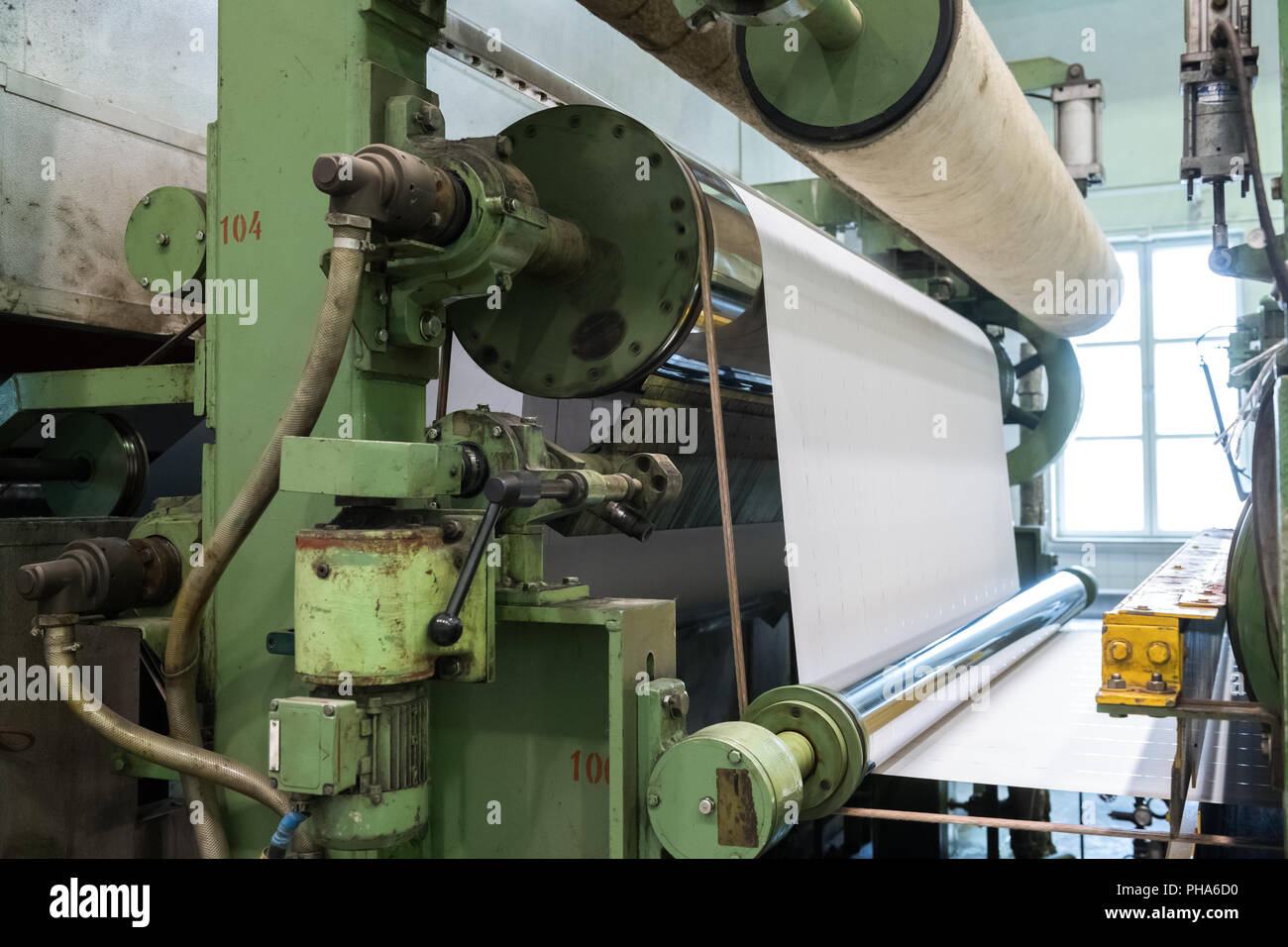 A roll of paper installed in a typographic machine Stock Photo - Alamy