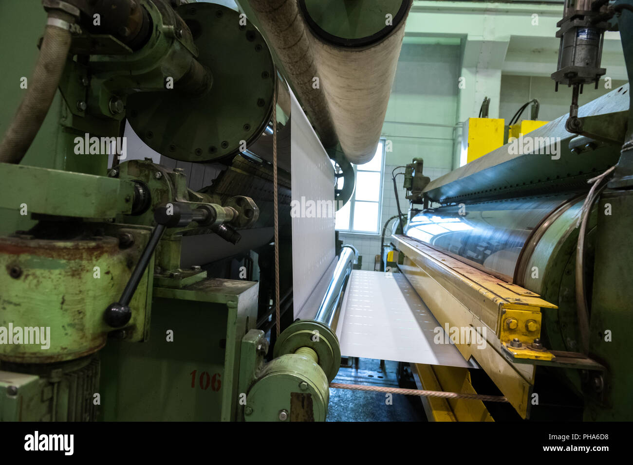 A roll of paper installed in a typographic machine Stock Photo - Alamy