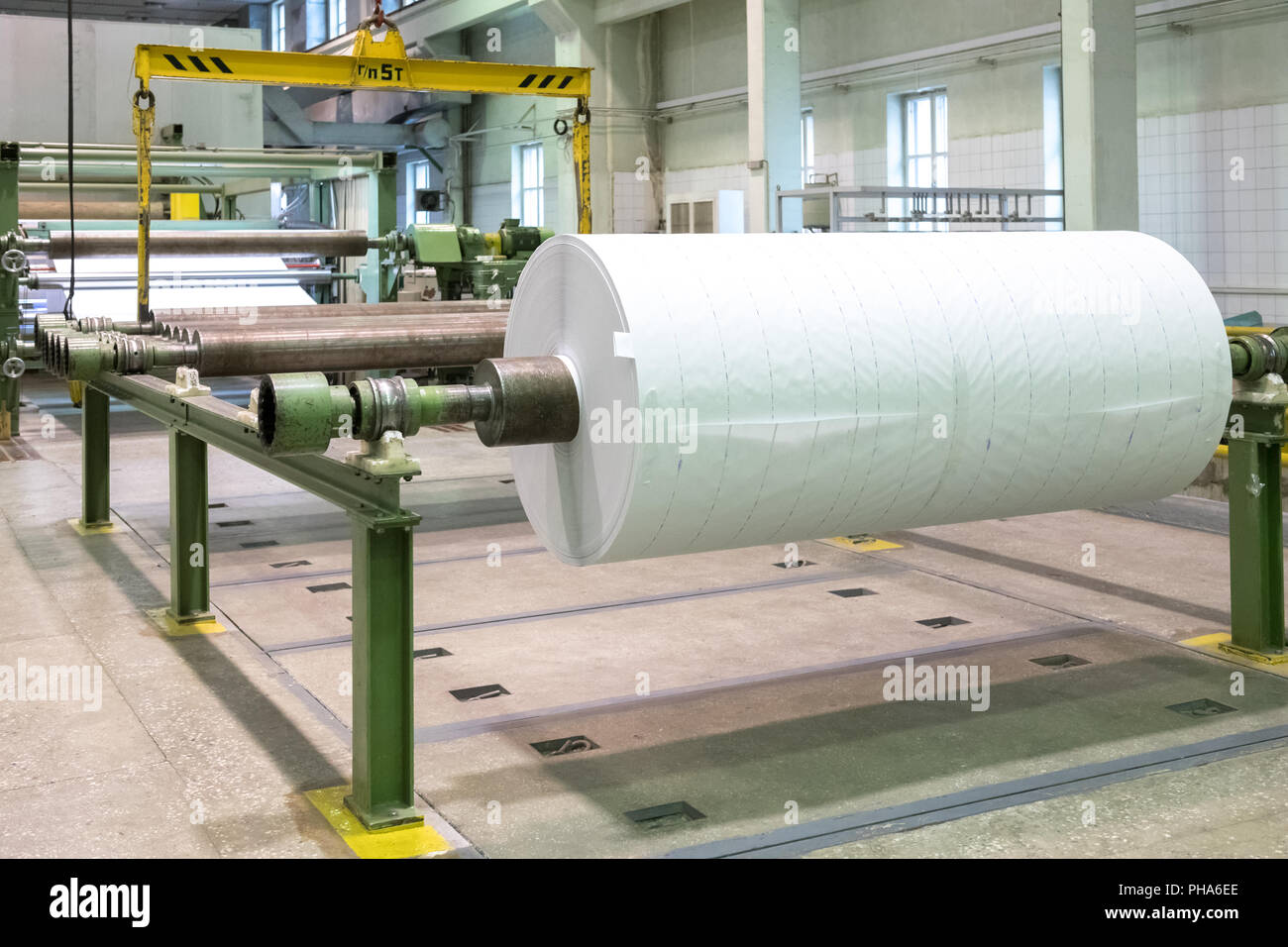 A roll of paper installed in a typographic machine Stock Photo - Alamy