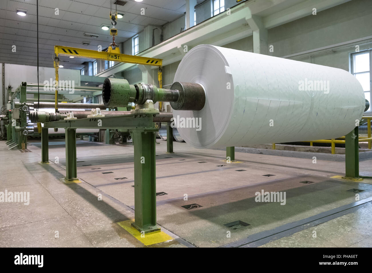 A roll of paper installed in a typographic machine Stock Photo - Alamy