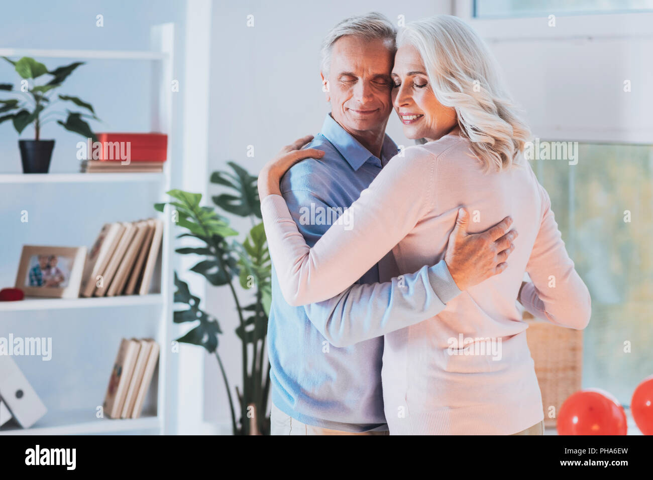 Tender woman standing near her husband Stock Photo - Alamy