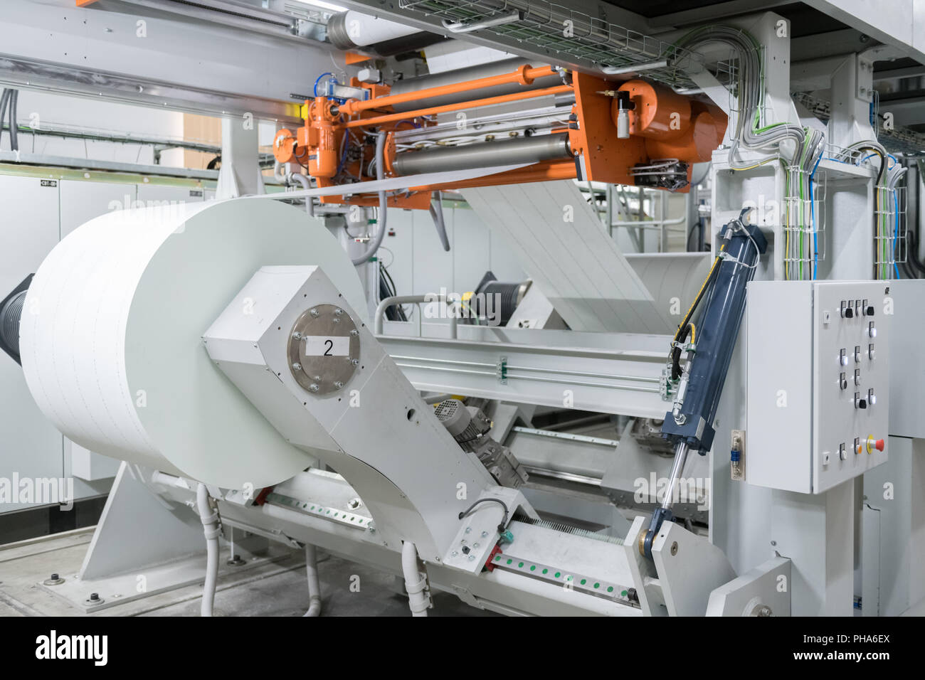 A roll of paper installed in a typographic machine Stock Photo - Alamy