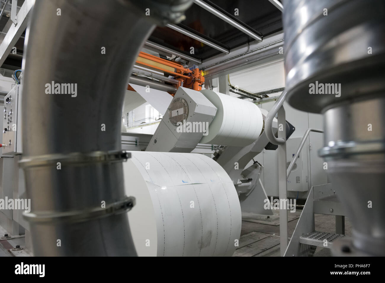 A roll of paper installed in a typographic machine Stock Photo - Alamy