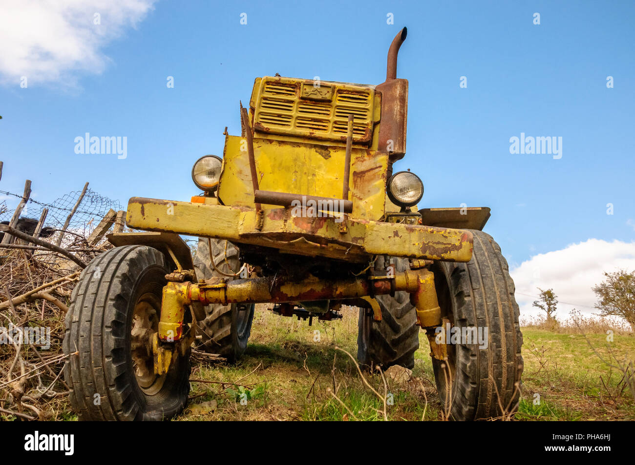 old rusty tractor close - up rural development concept Stock Photo - Alamy