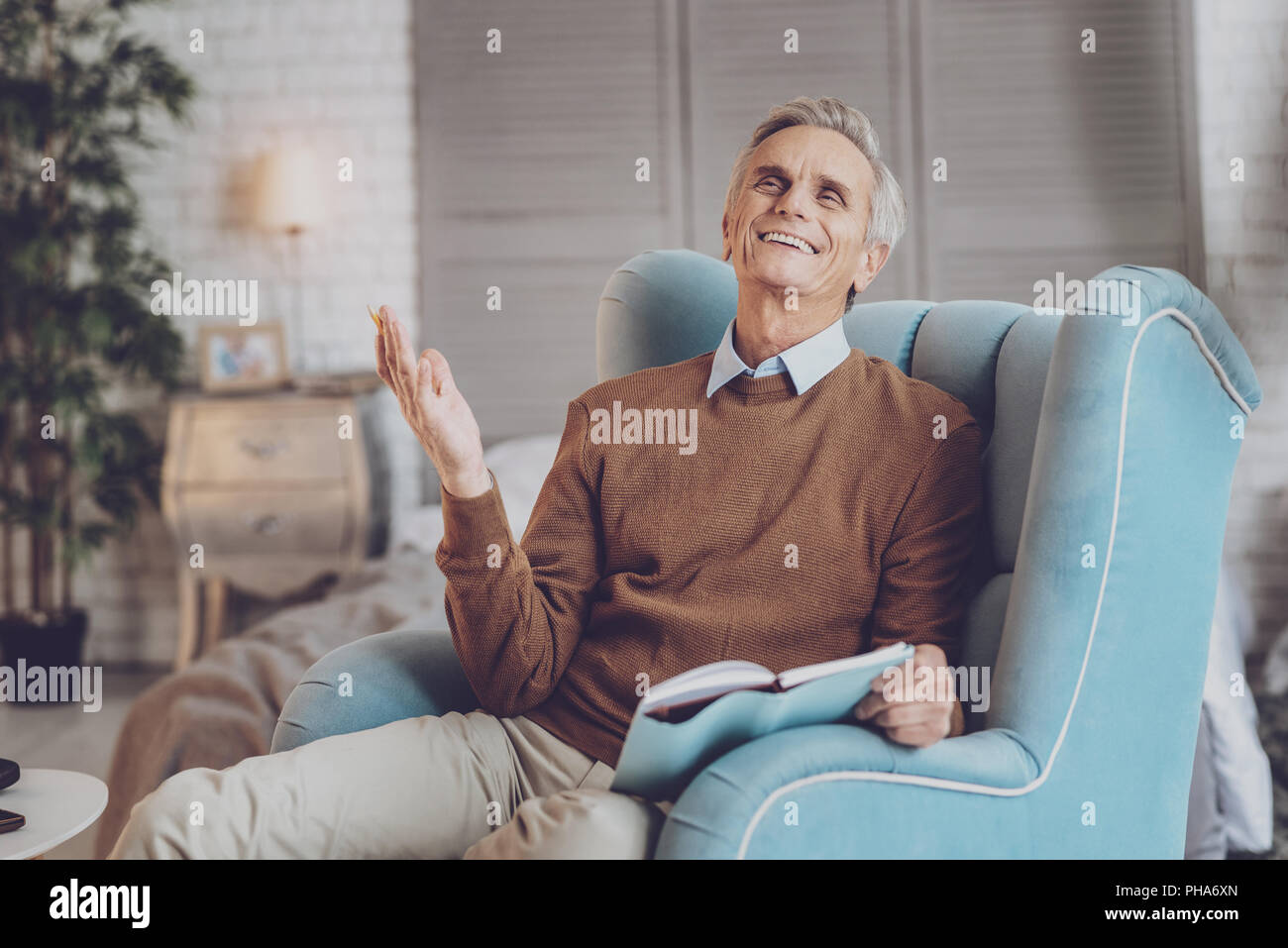 Happy retirement sitting in his room Stock Photo - Alamy