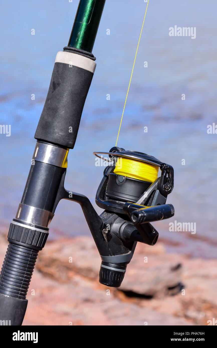Fishing with rod on lake Stock Photo - Alamy
