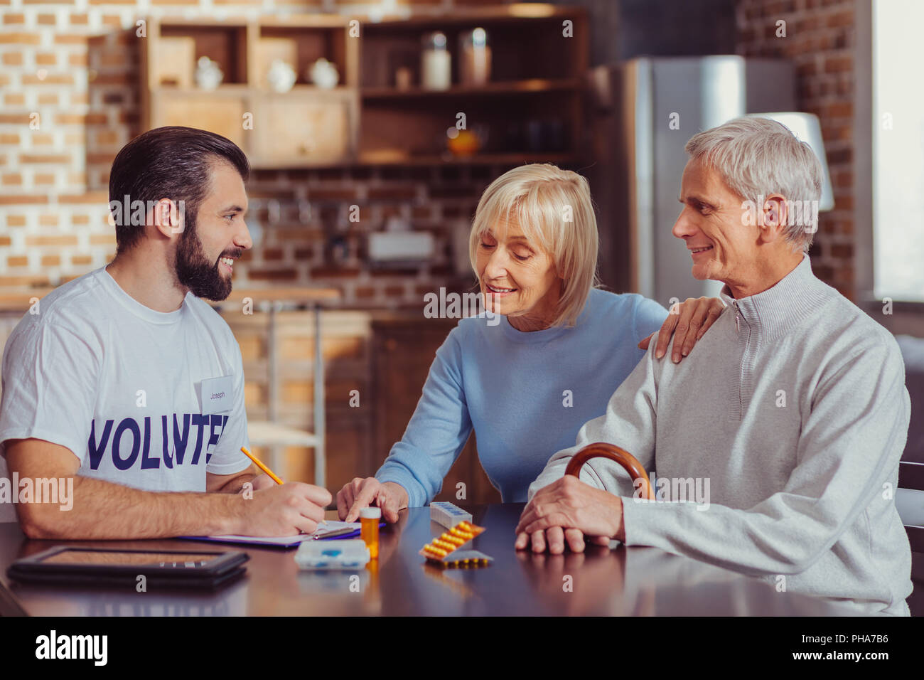 Curious interested woman sitting and pointing at notebook Stock Photo ...