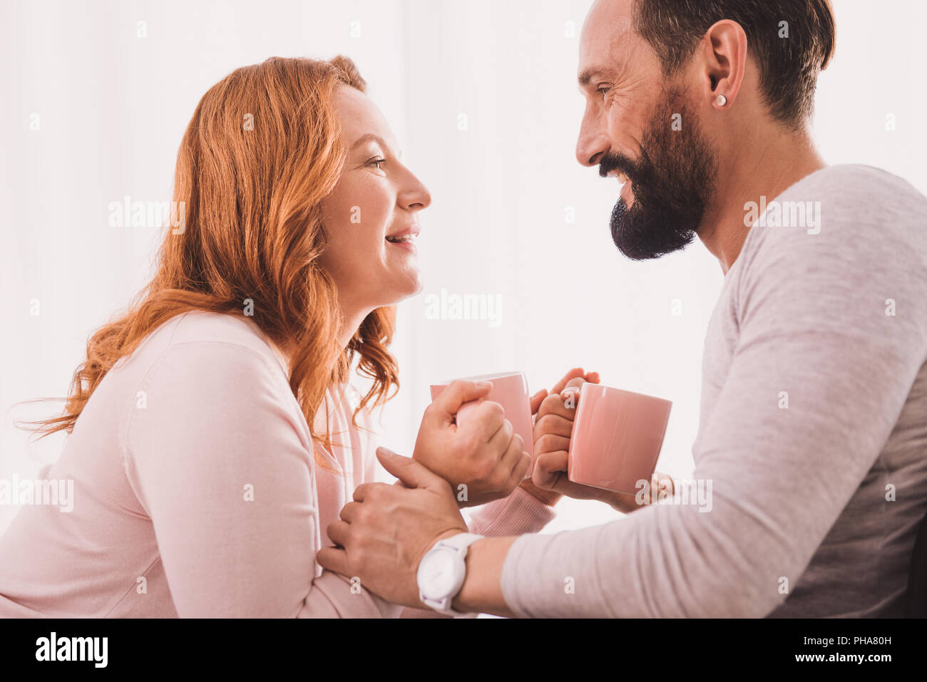 Happy mid aged couple expressing love Stock Photo - Alamy