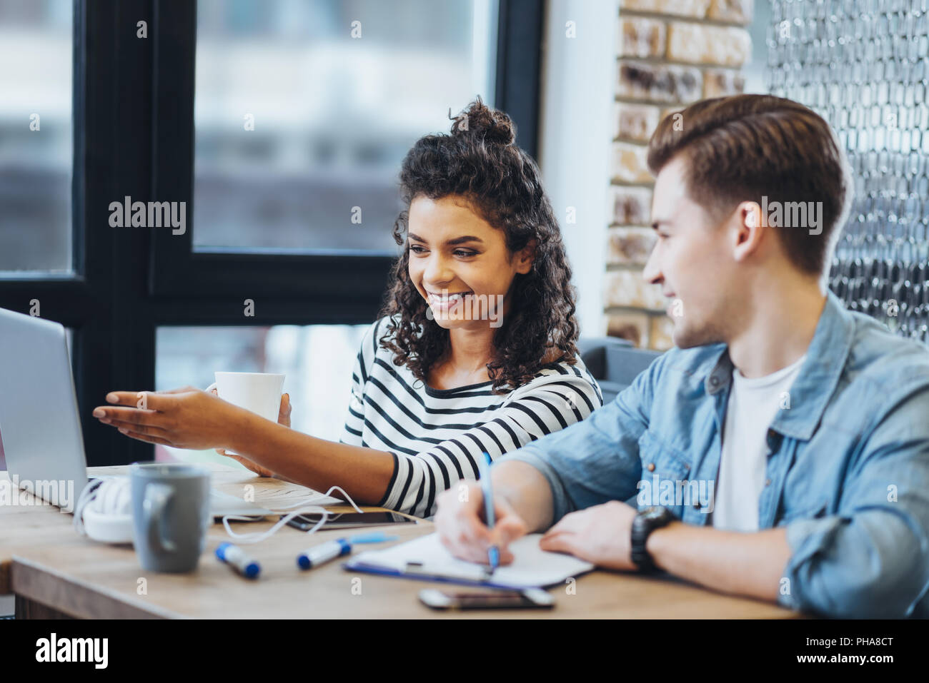 Adorable two students studying Stock Photo - Alamy