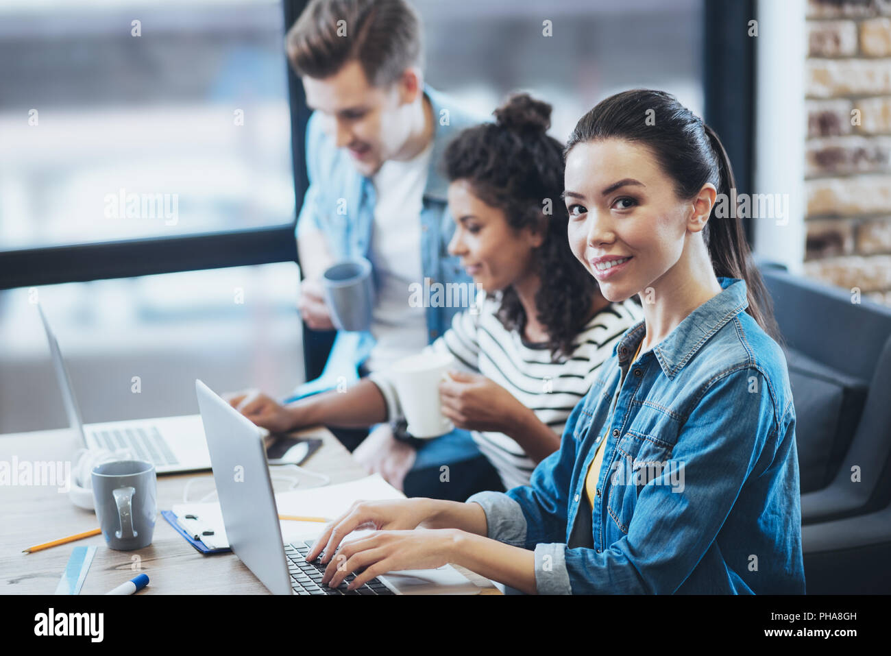 Beautiful female student typing Stock Photo - Alamy