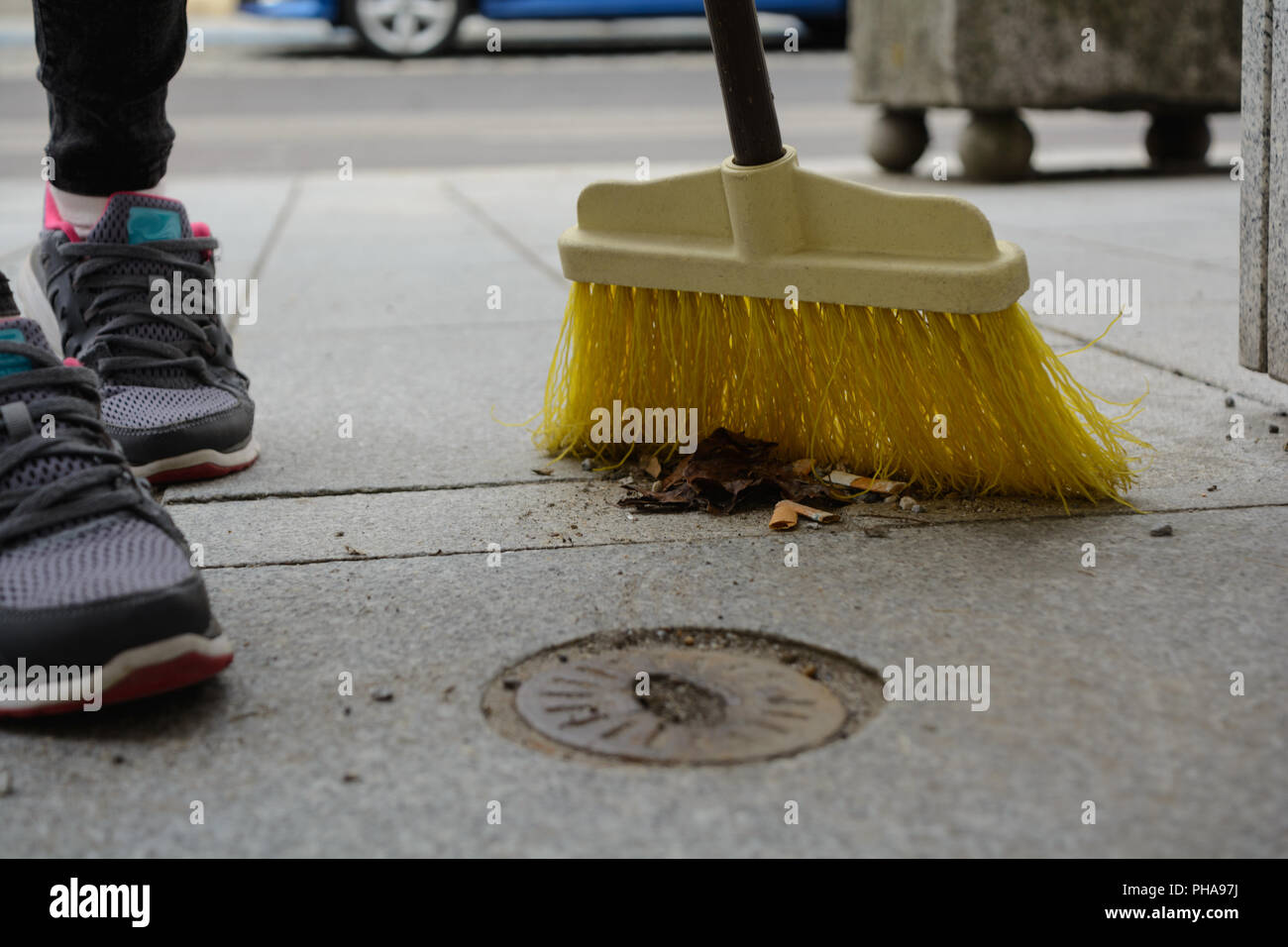 Road sweeper cleans the street - close-up with sweepers Stock Photo - Alamy