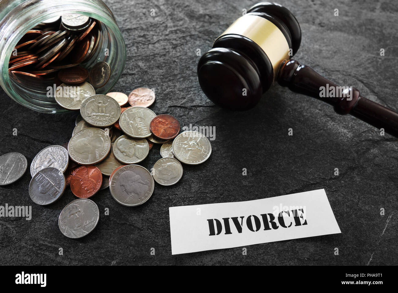 Divorce message with coins and gavel Stock Photo - Alamy