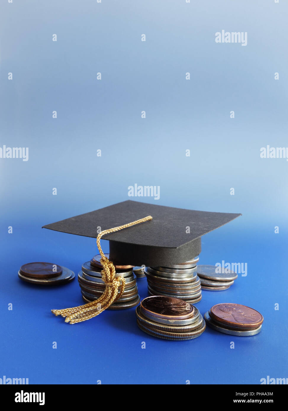 grad cap and coins Stock Photo - Alamy