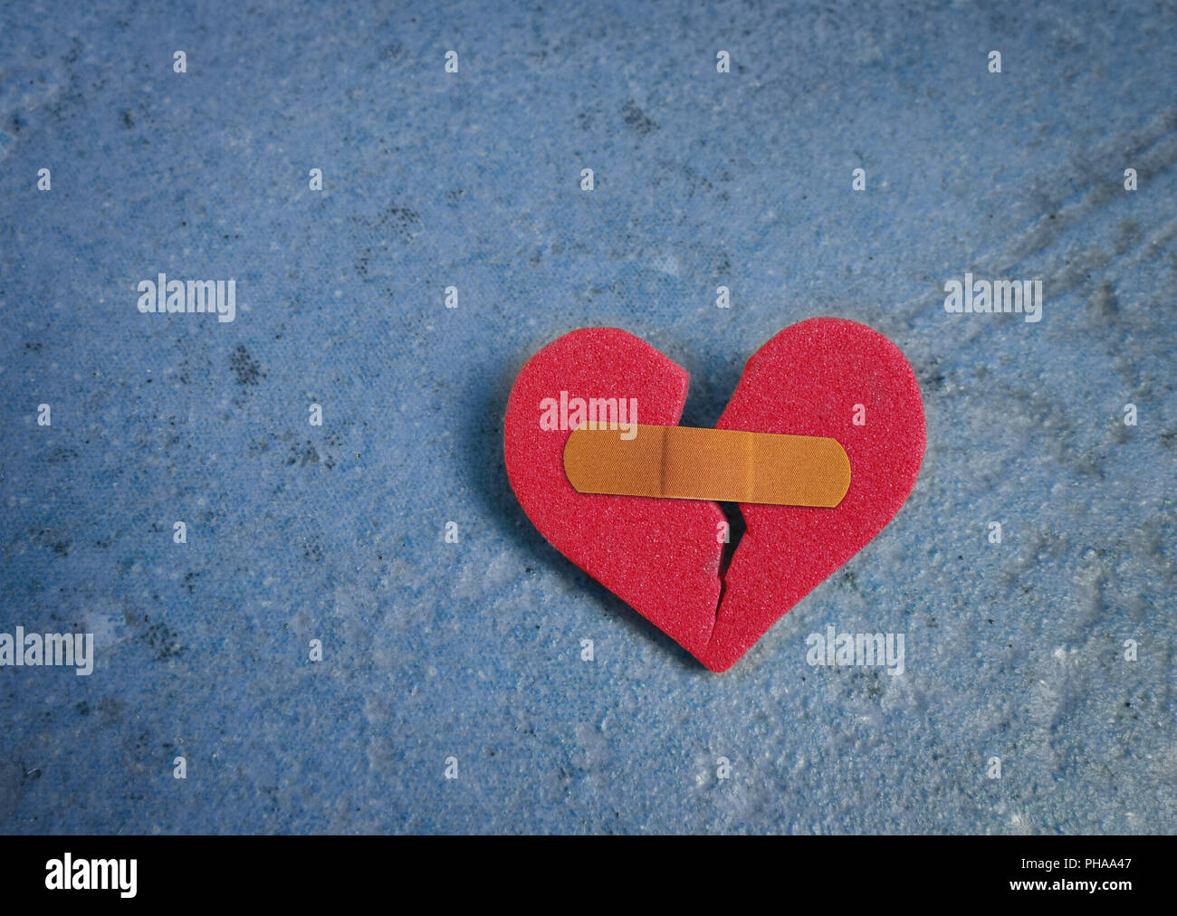 Broken heart with bandage hi-res stock photography and images - Alamy