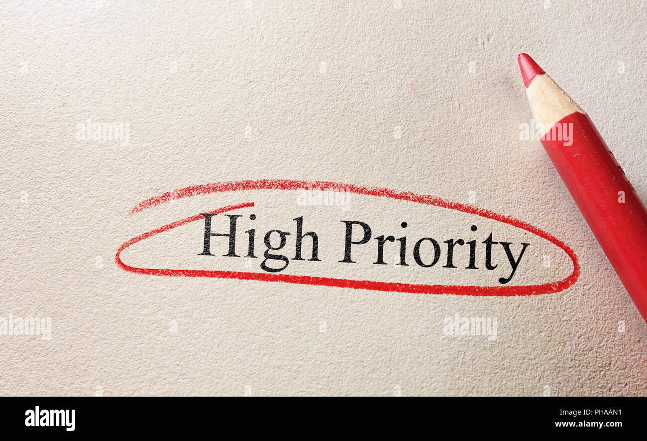 High Priority red circle Stock Photo - Alamy