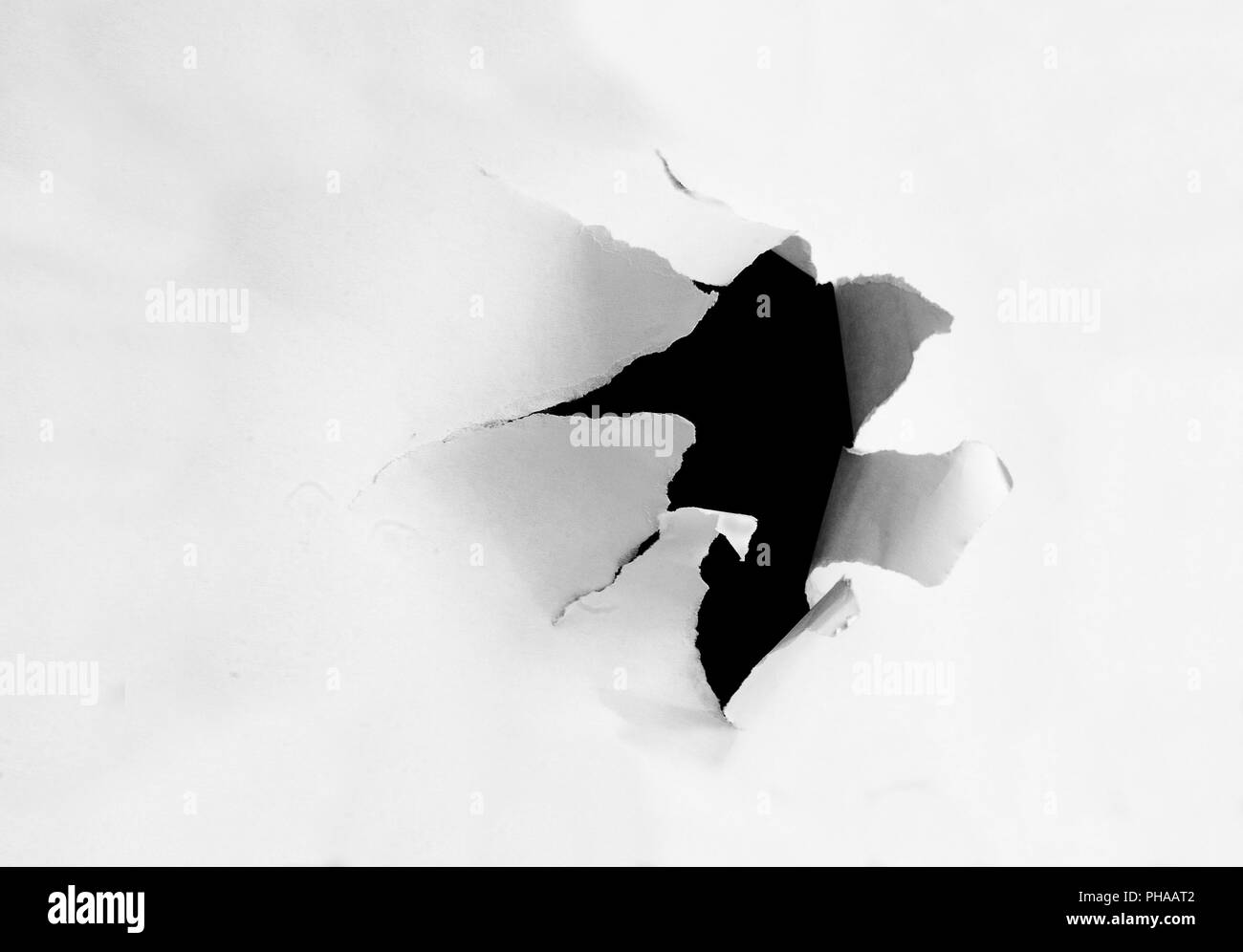 Torn paper hole side Black and White Stock Photos & Images - Alamy