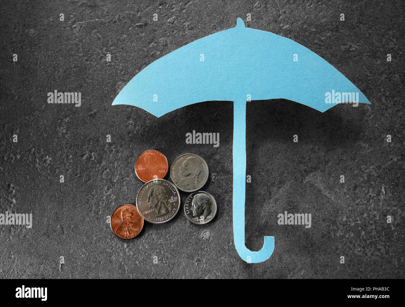 Umbrella over money Stock Photo - Alamy