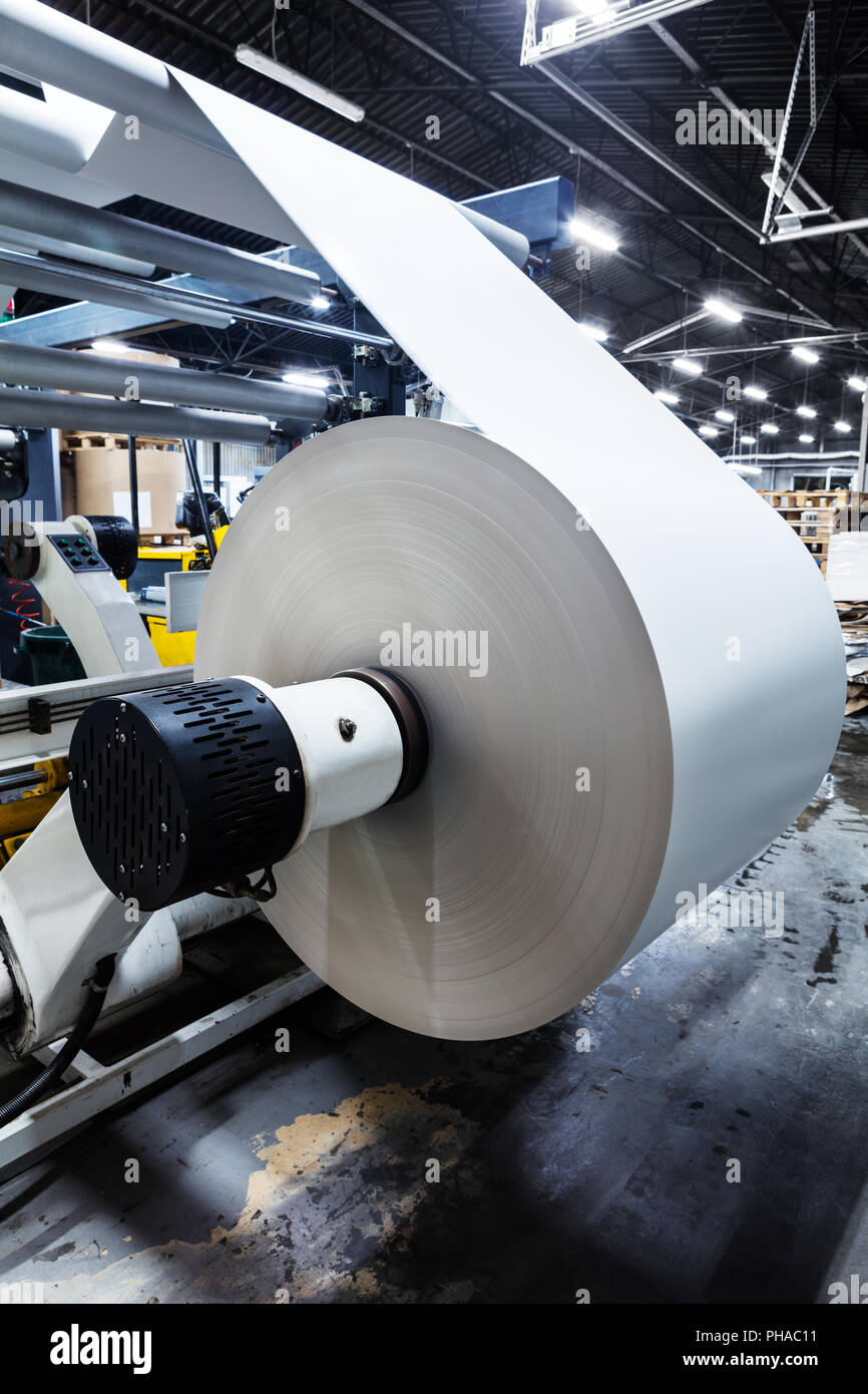 unwinding a roll of paper Stock Photo - Alamy