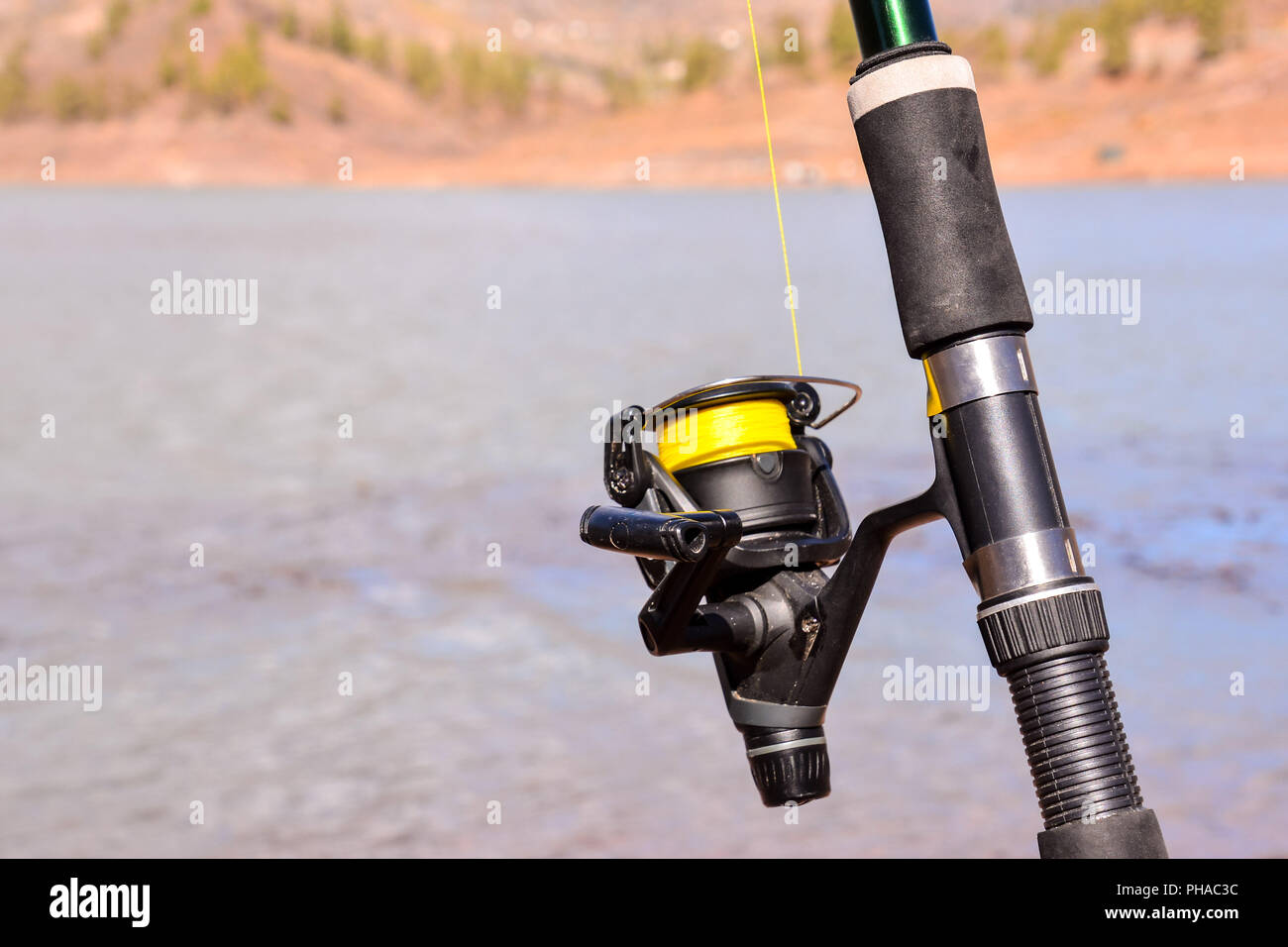 Fishing with rod on lake Stock Photo - Alamy