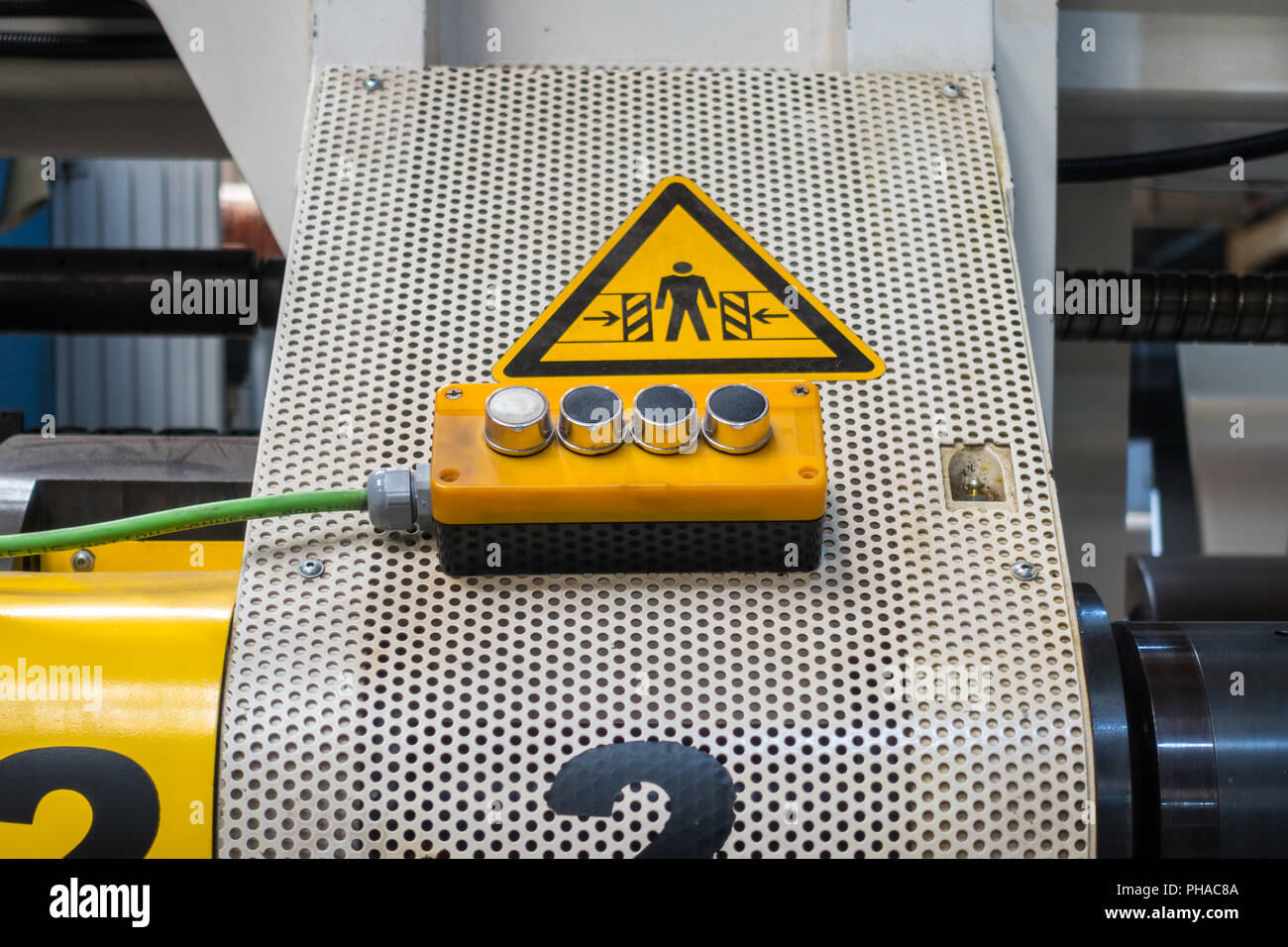 Warning Sign Above Machine Control Panel Buttons Stock Photo - Alamy