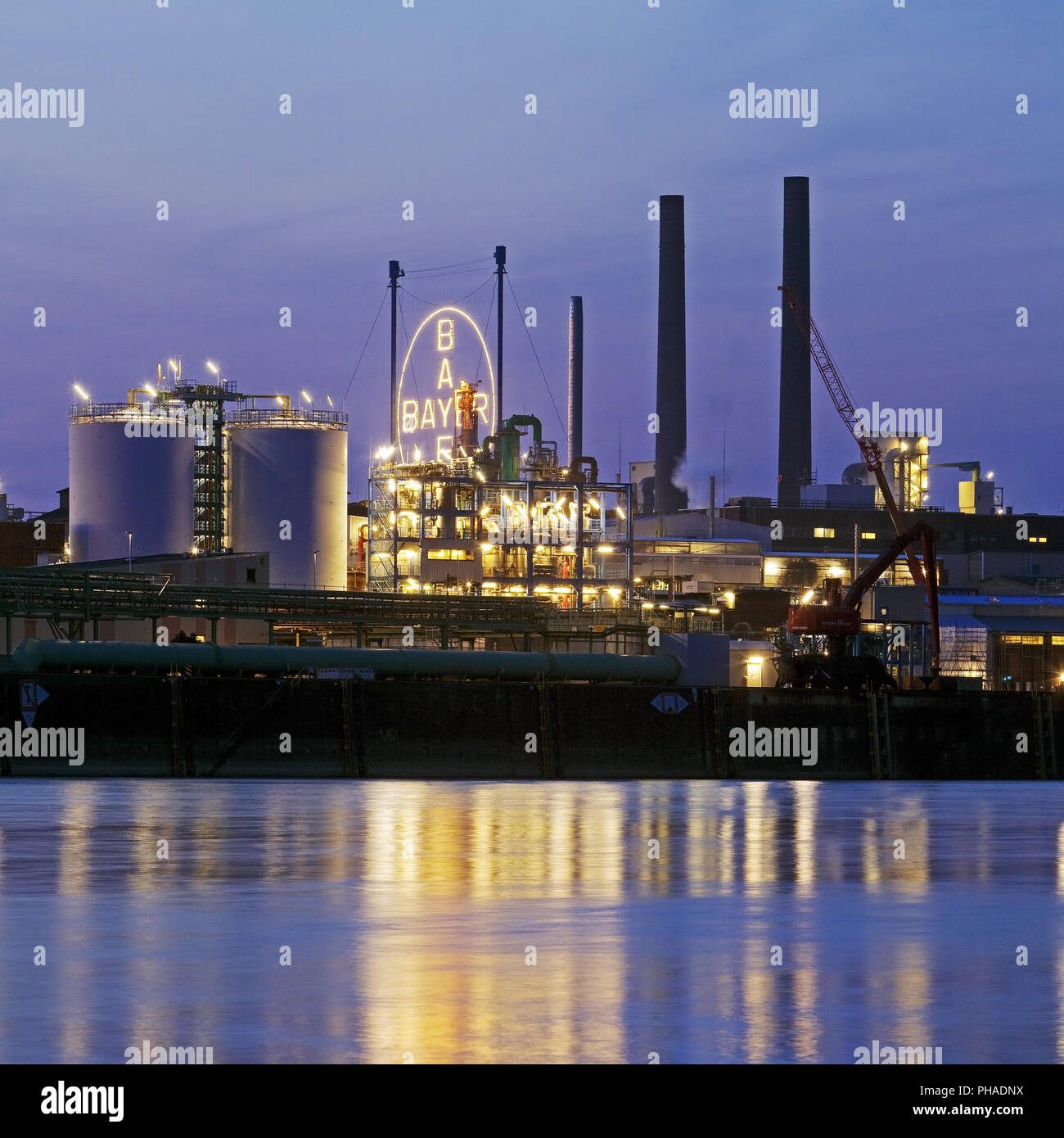 Bayer Cross in the blue hour, chemical factory at the Rhine, Leverkusen ...