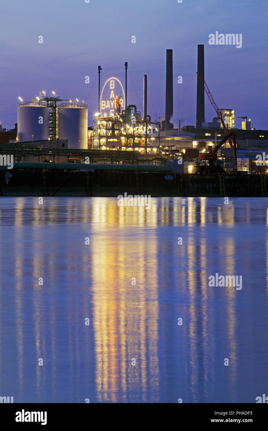 Bayer Cross in the blue hour, chemical factory at the Rhine, Leverkusen ...