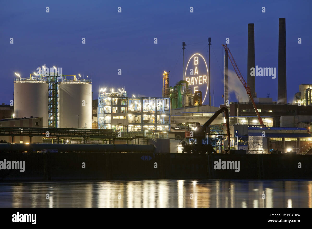 Bayer Cross in the blue hour, chemical factory at the Rhine, Leverkusen ...
