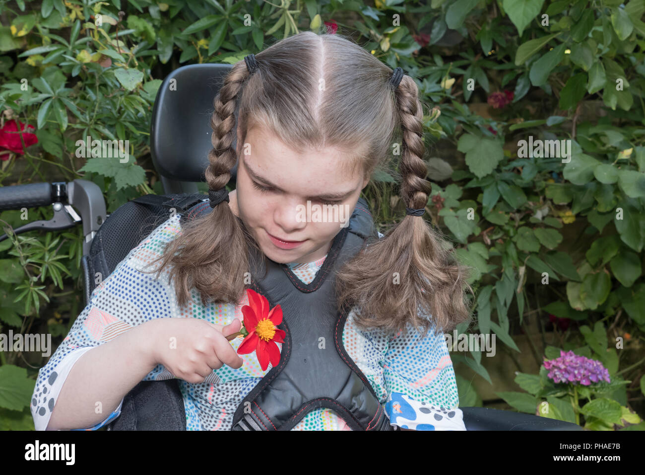 Disability, a disabled person with learning difficulties being cared ...