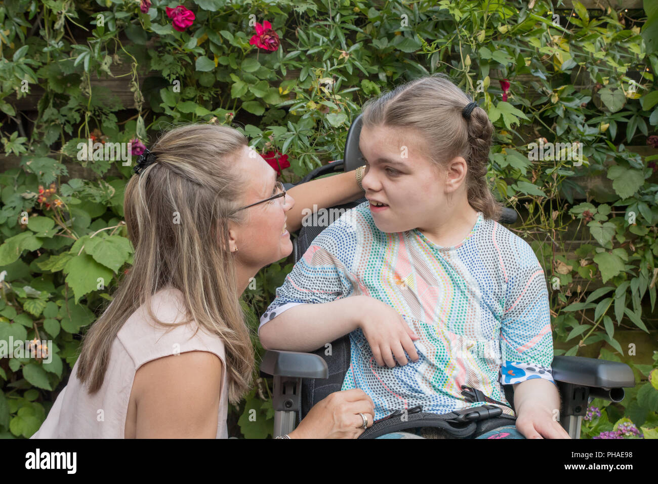 Disability, a disabled person with learning difficulties being cared ...