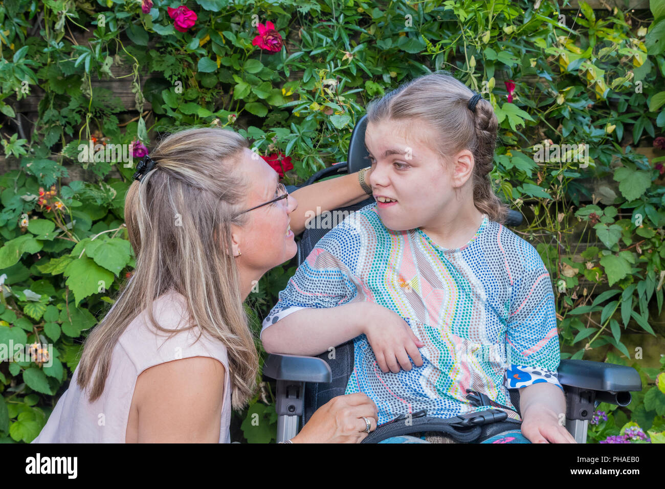 Disability, a disabled person with learning difficulties being cared ...