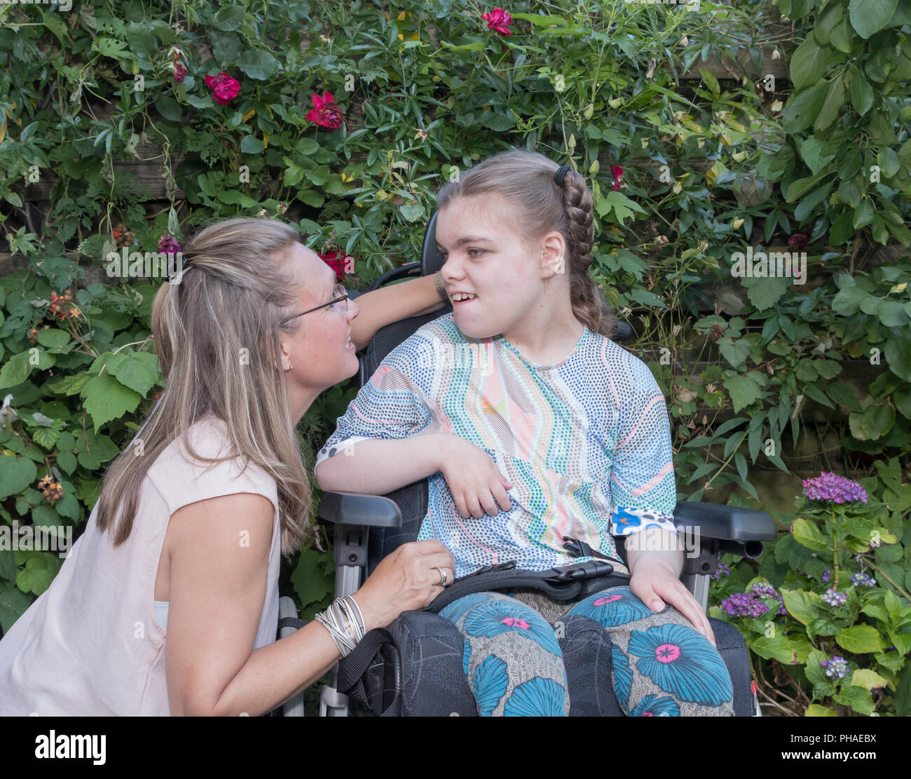 Disability, a disabled person with learning difficulties being cared ...