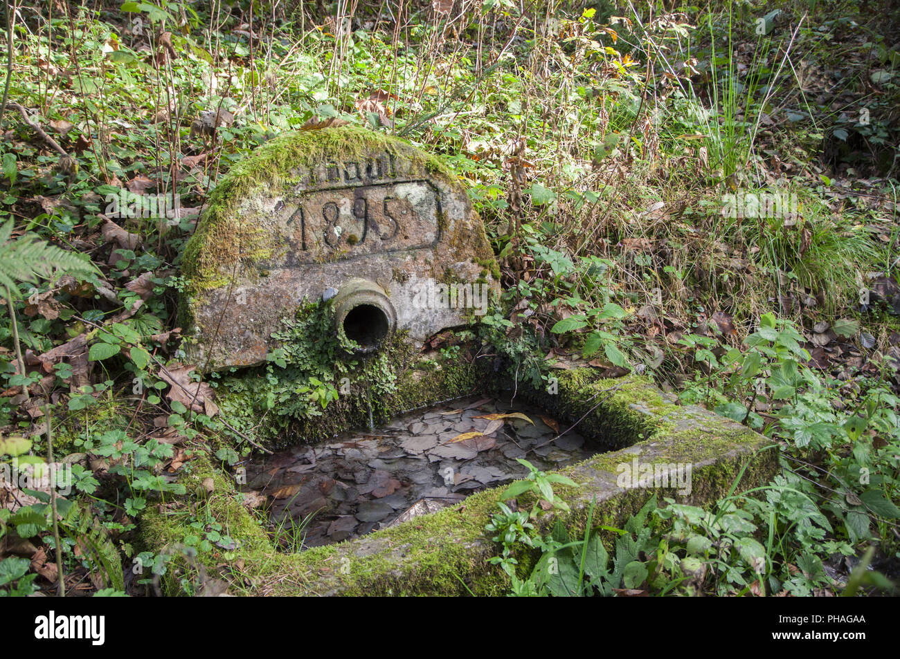 historic water well in the woods around Mainhardt, Germany Stock Photo ...