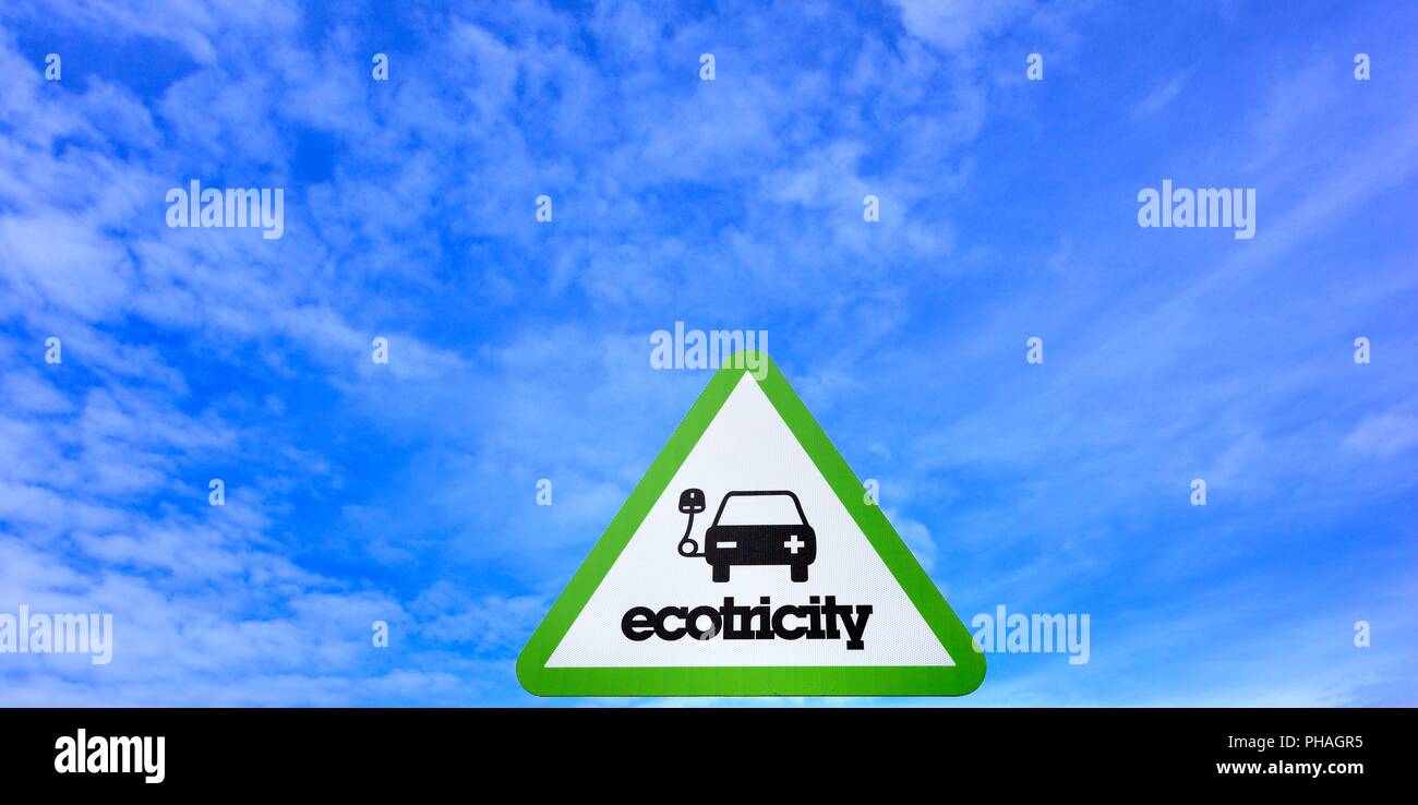 Ecotricity charging point sign blue sky Stock Photo - Alamy