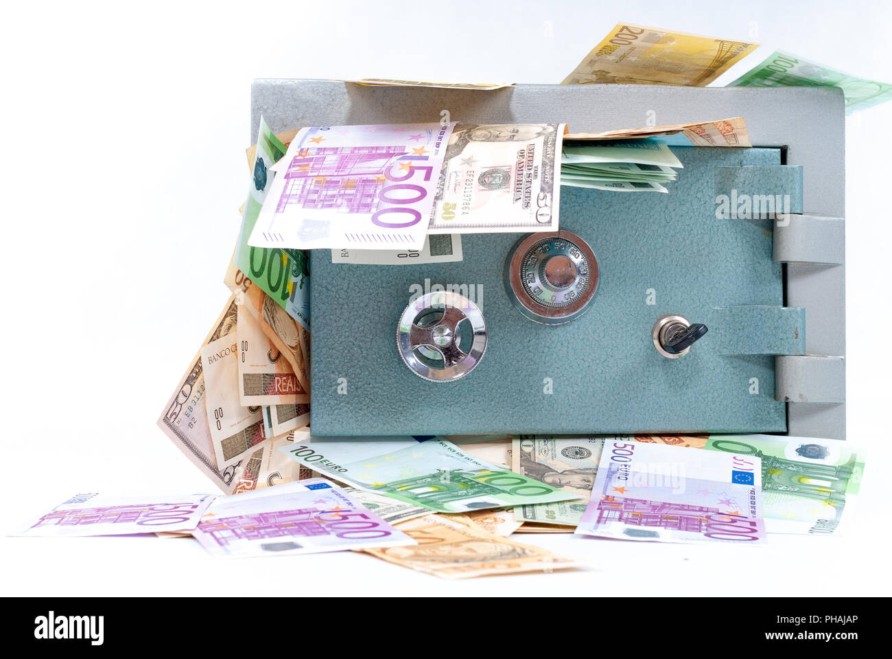 Safe full of money coming out Stock Photo - Alamy