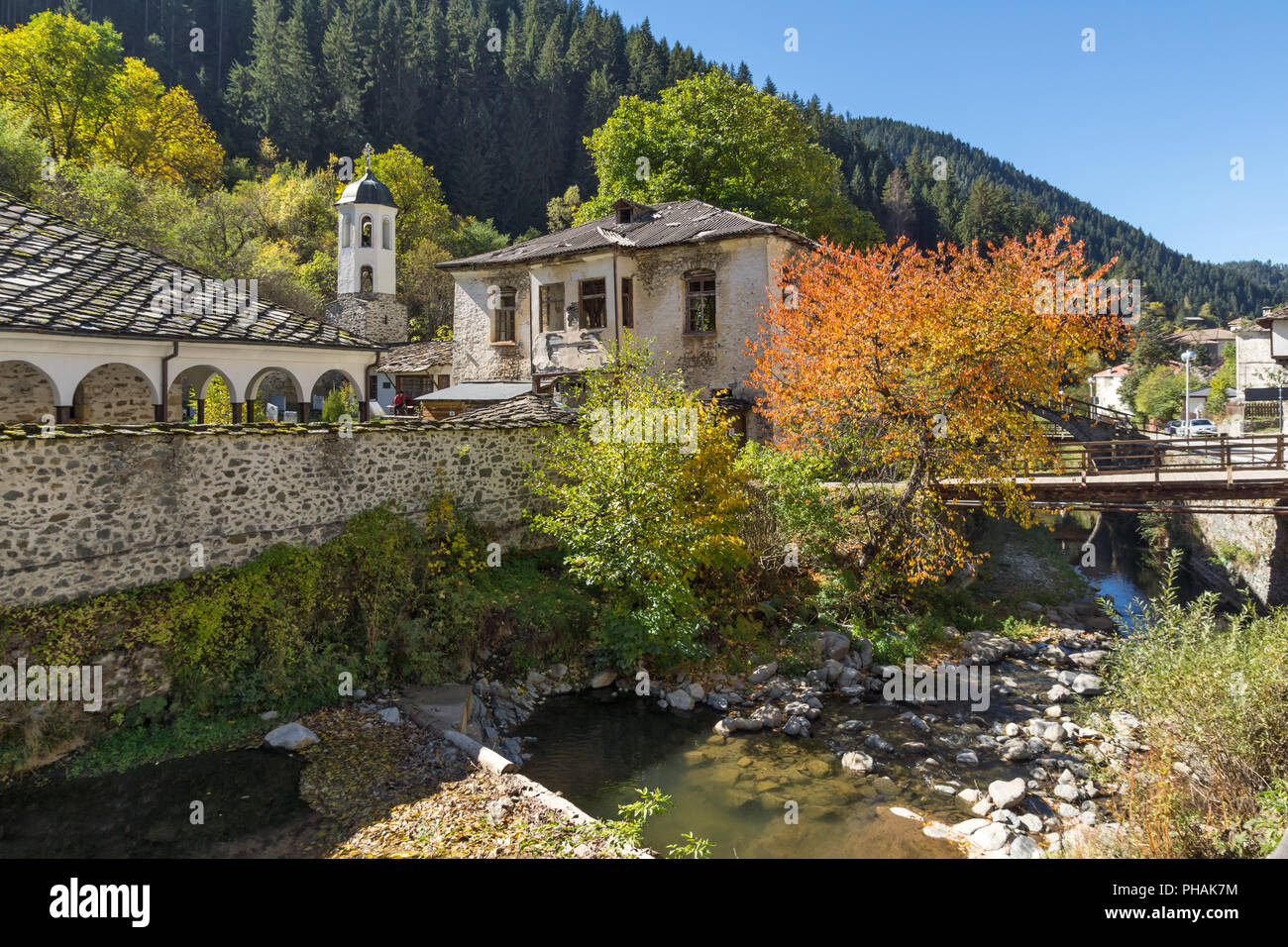 19th century Church of the Assumption, river and Autumn tree in town of ...