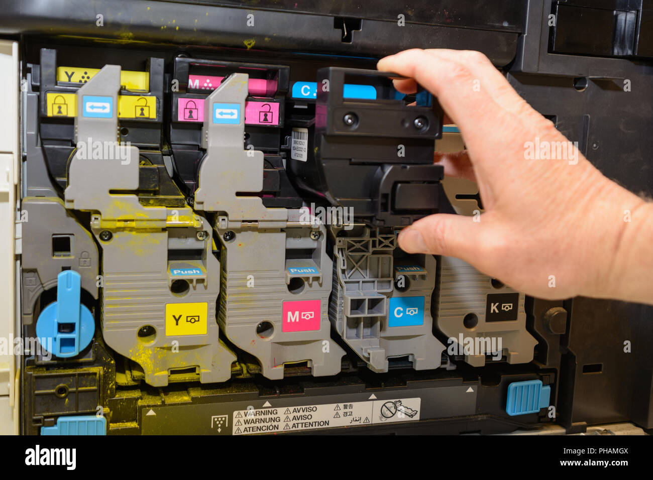 Person replaces color cartridge with laser printer - close-up Stock ...