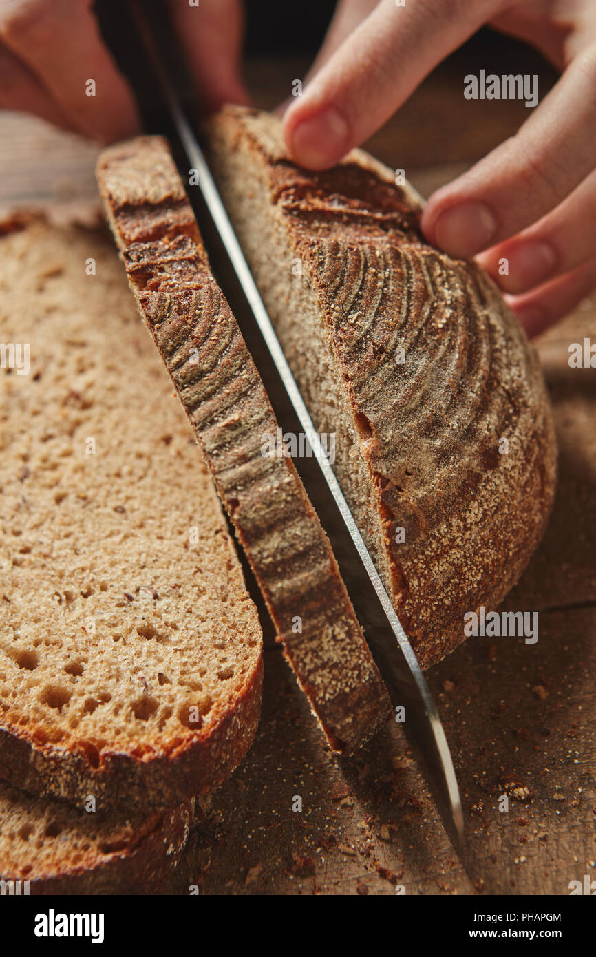 Female hands slice bread hi-res stock photography and images - Alamy