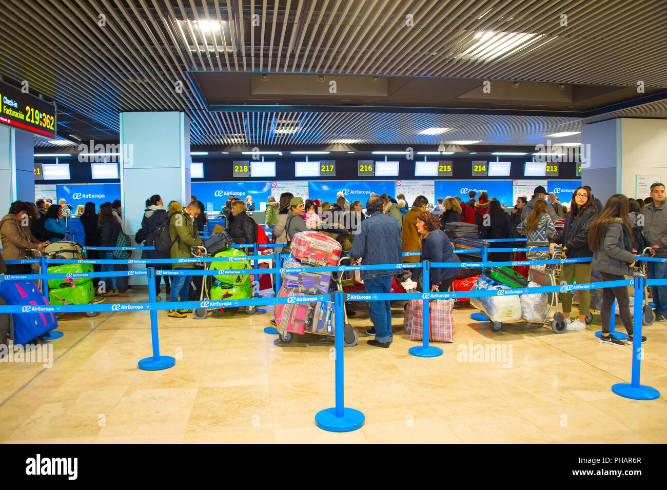 Check-in counter in airport Stock Photo - Alamy