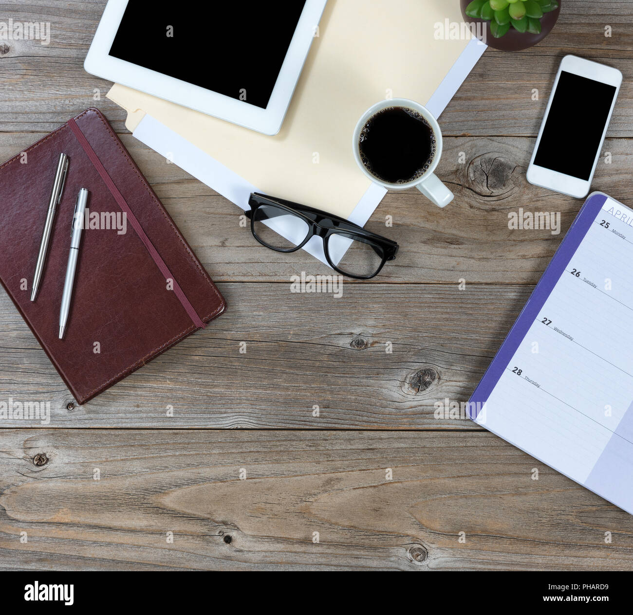 Desktop with a mixture of technology and traditional objects Stock ...