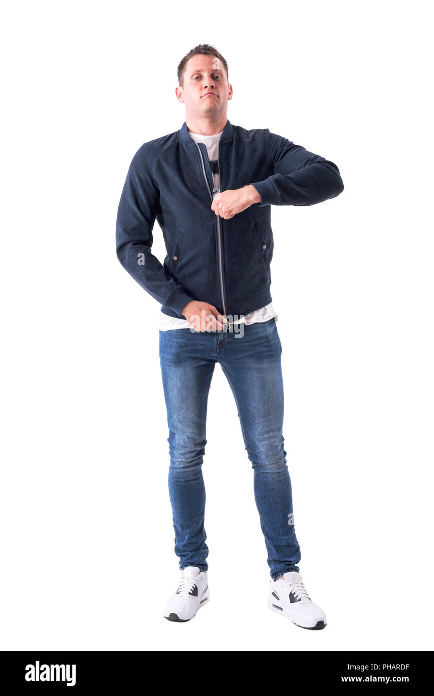 Serious young adult casual man get dressed fastening bomber jacket ...