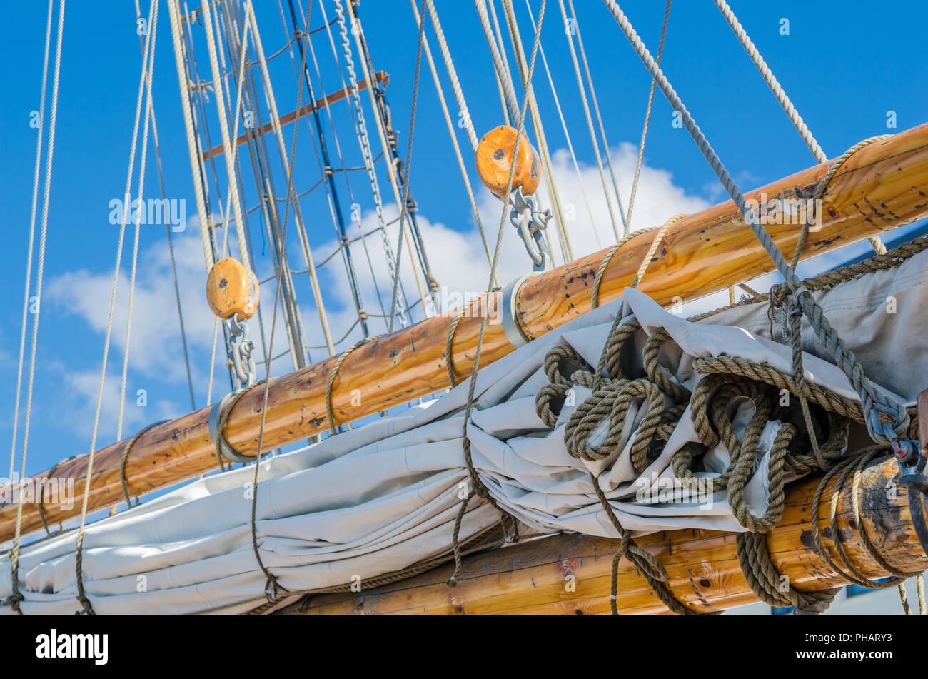 Folded sail and mast on an old sailboat Stock Photo - Alamy