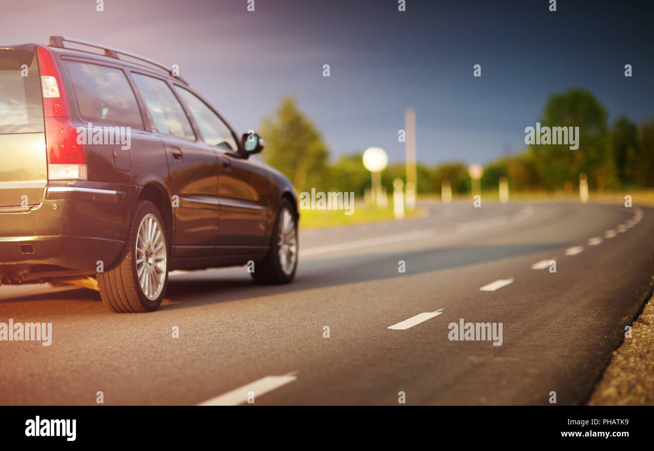 Road panorama on sunny spring evening with car Stock Photo - Alamy