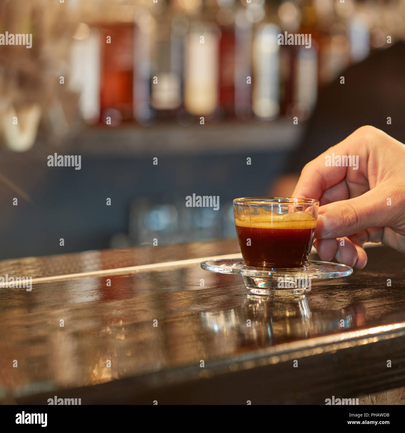 Hand holds cup of coffee Stock Photo - Alamy
