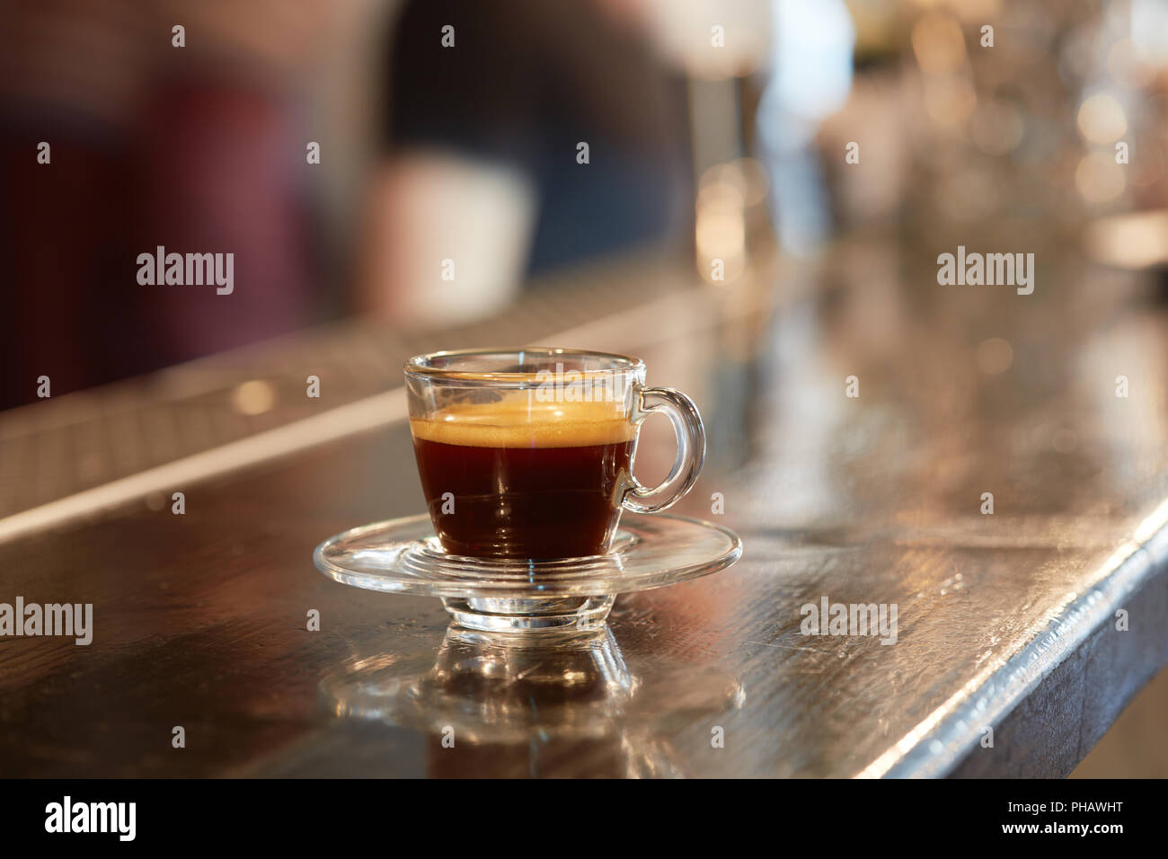 Cup of coffee on bar counter Stock Photo - Alamy