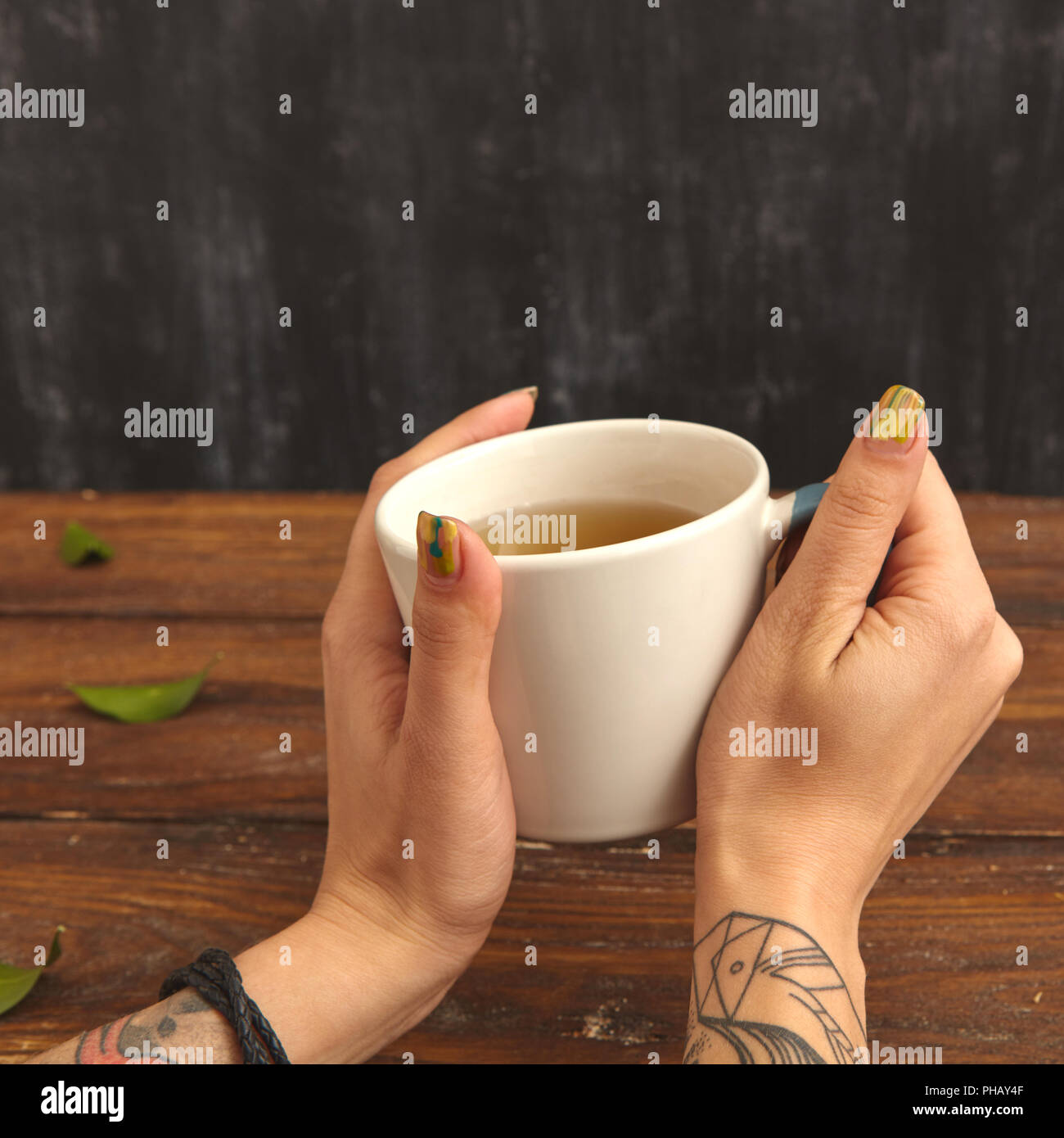 Woman holding hot cup hi-res stock photography and images - Alamy