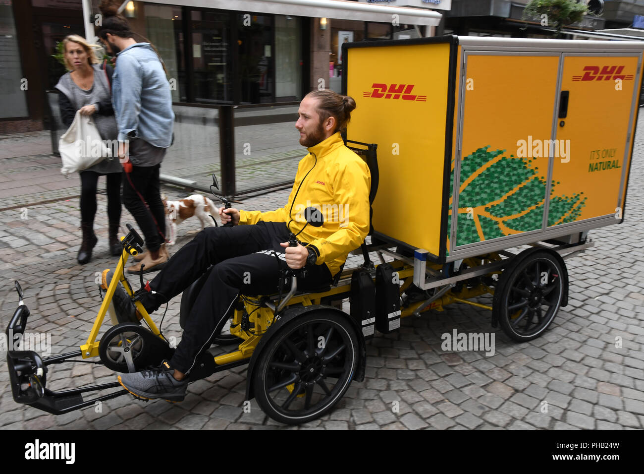 Malmo/Malmoe/MalMö/Sweden 31.August 2018 .DHL deliver by 4 weels bikes ...