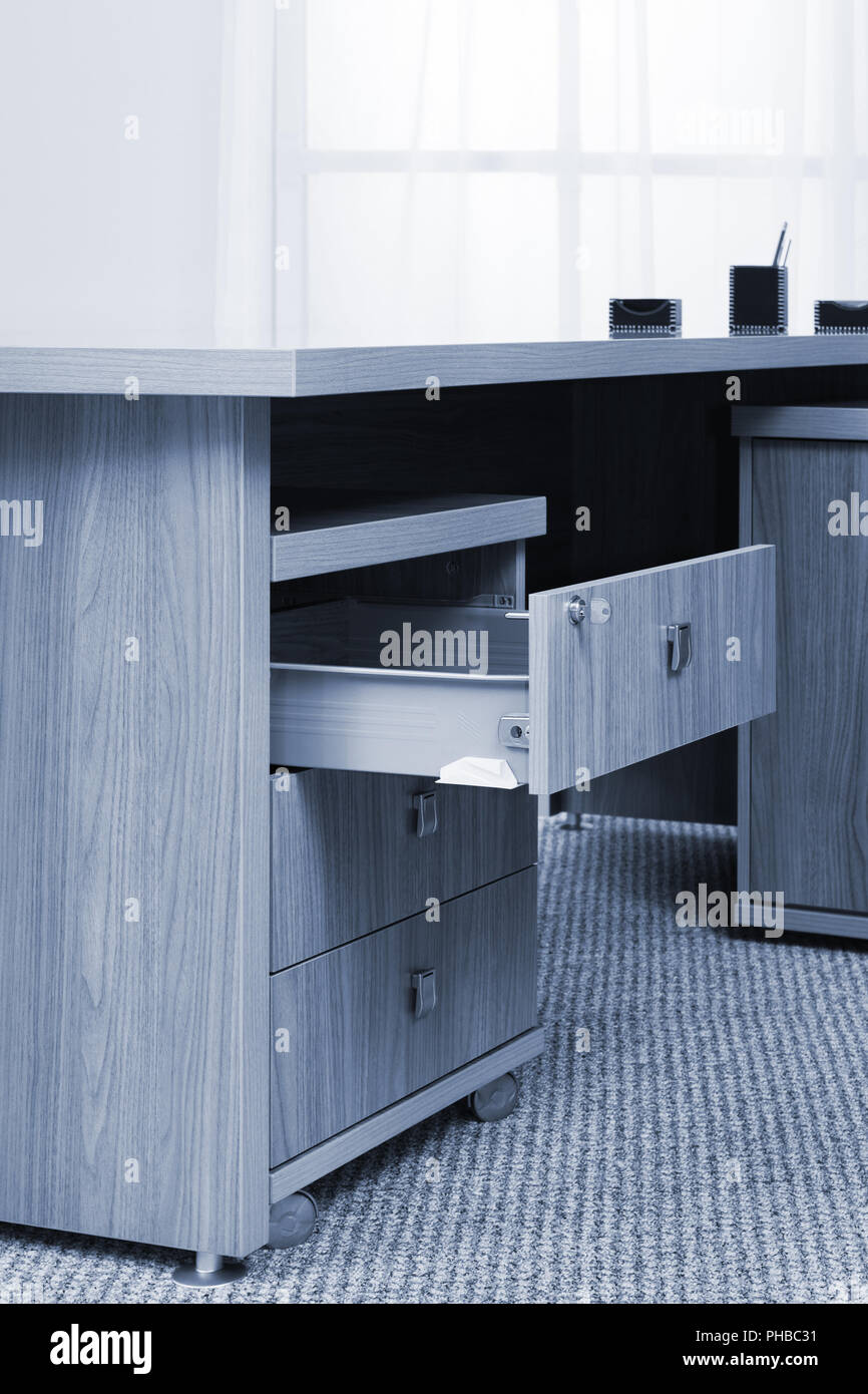 desk with an open drawer Stock Photo - Alamy